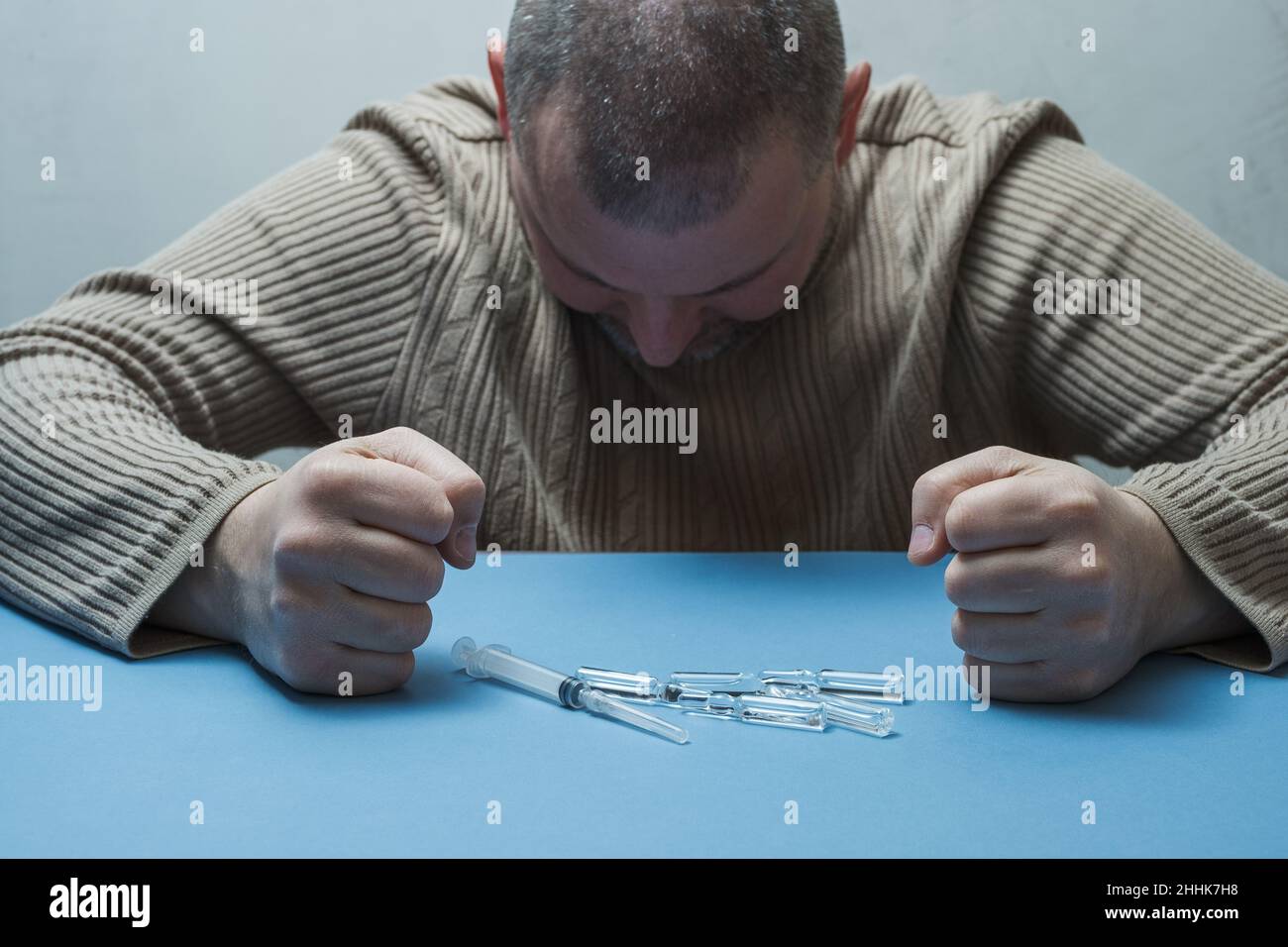 The man lowered his head and clenched his hands into fists, medical ...