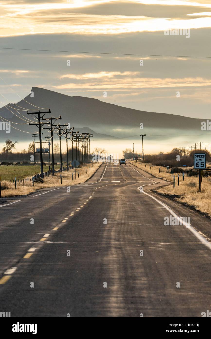 USA, Idaho, Bellevue, Rural road with mountain and morning mist in ...