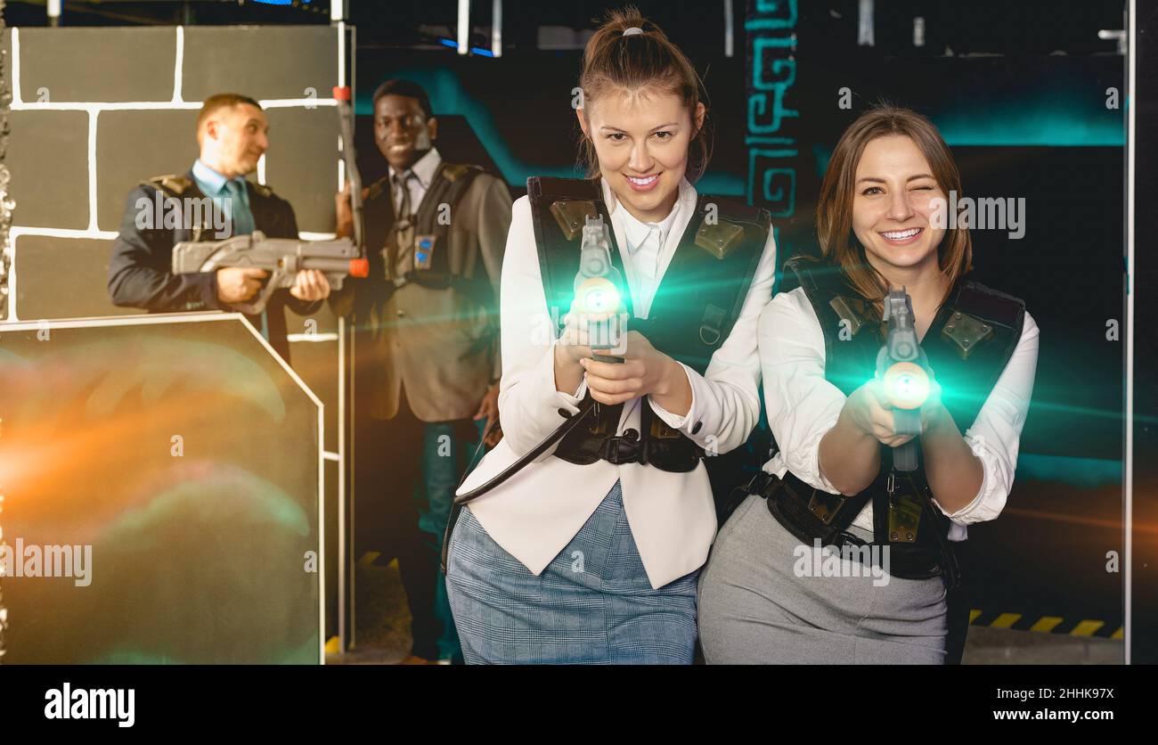 Two women having corporative entertainment Stock Photo - Alamy