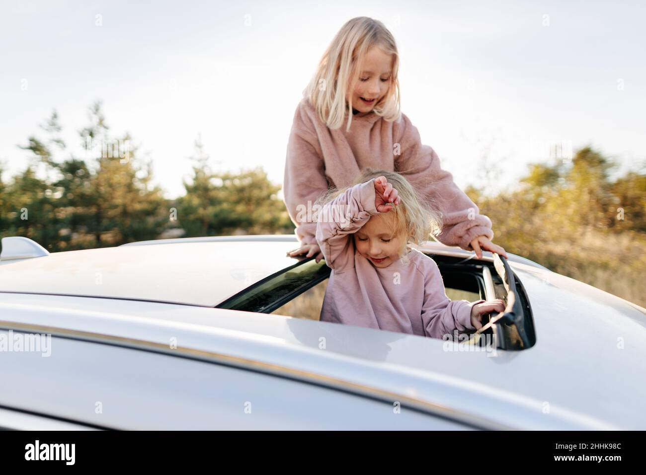 Sunroof of car arms raised hi-res stock photography and images - Alamy