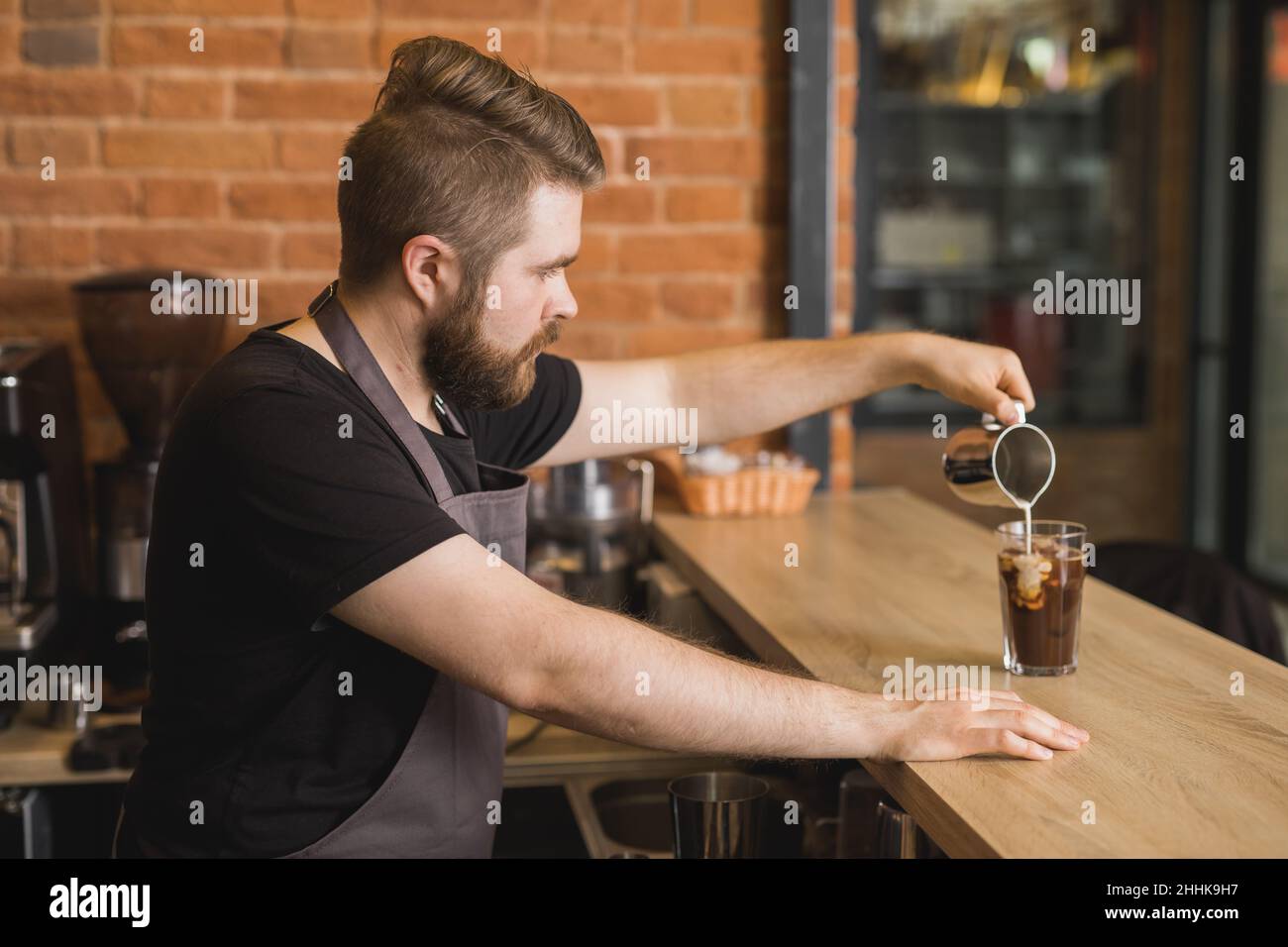 Concentrated male barista in hi-res stock photography and images - Alamy