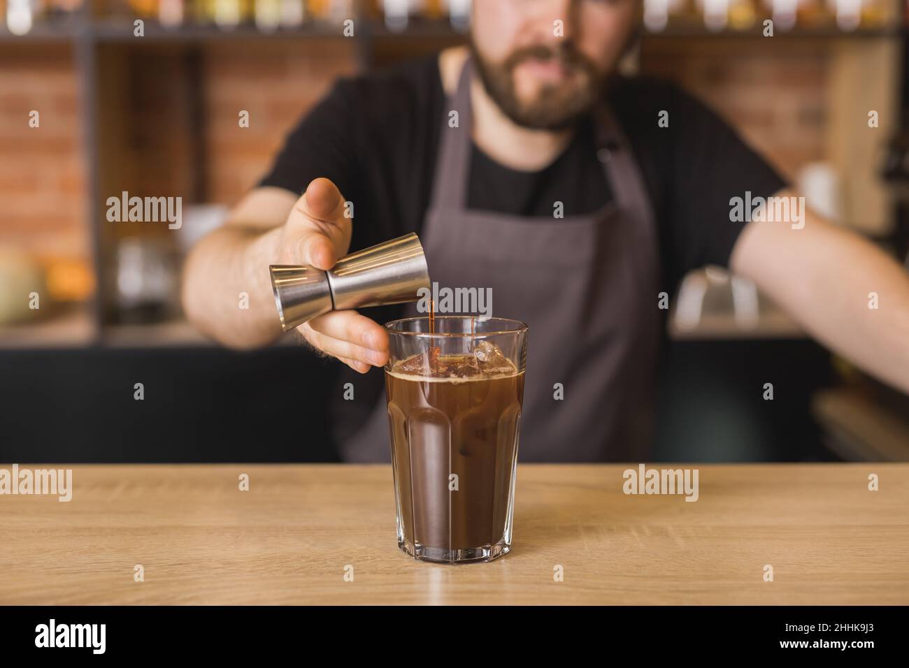 Man pouring syrup from jigger hi-res stock photography and images - Alamy