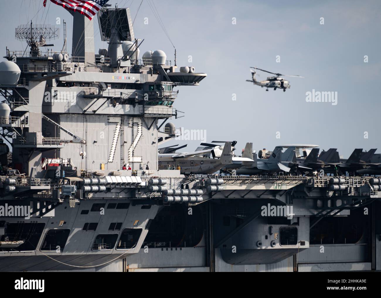 PHILIPPINE SEA (Jan. 22, 2022) An MH-60R Sea Hawk helicopter, assigned ...