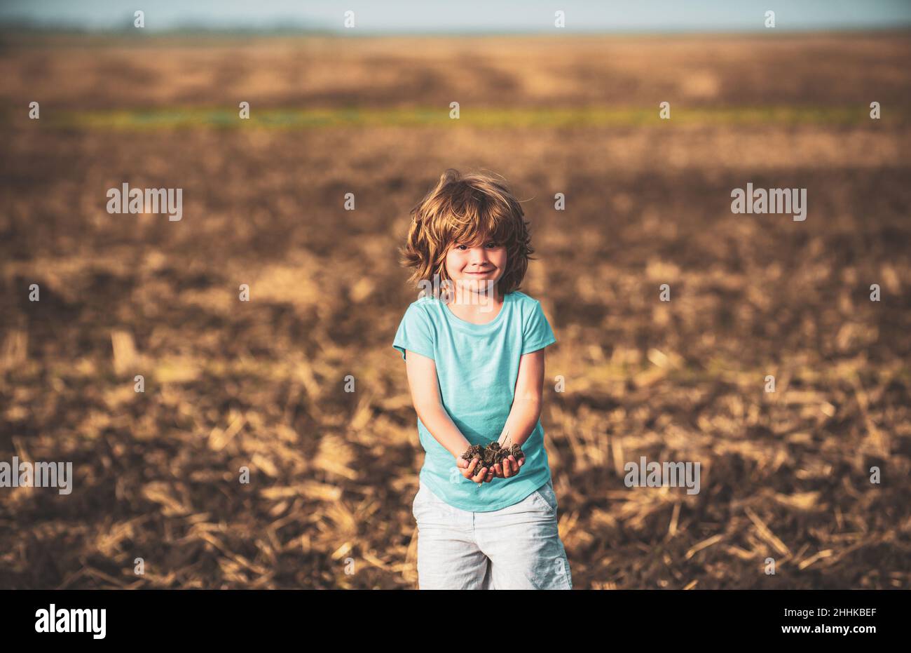 Kids farmer. American child on farm. Soil and ground concept. Textured ...
