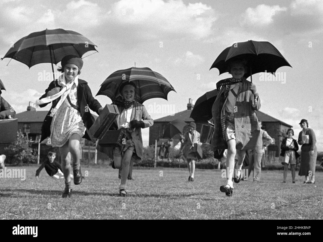 The umbrella race during a schools sports day in Kingston Upon Thames ...