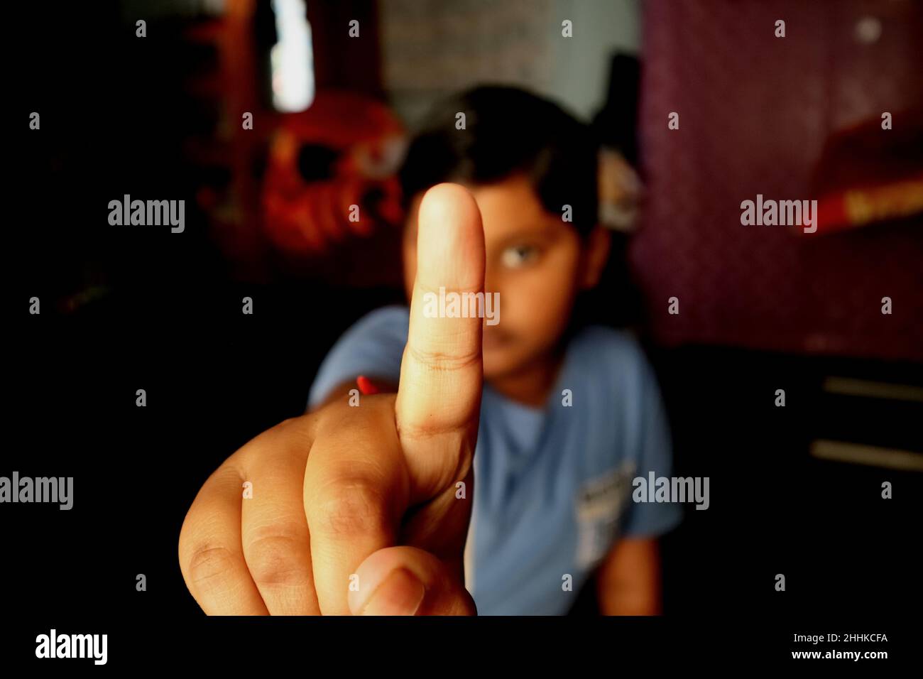 A kid showing one fingers and hand with a smiling face Stock Photo - Alamy