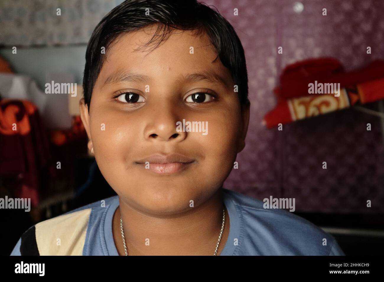 A over smiling face of a kid Stock Photo - Alamy