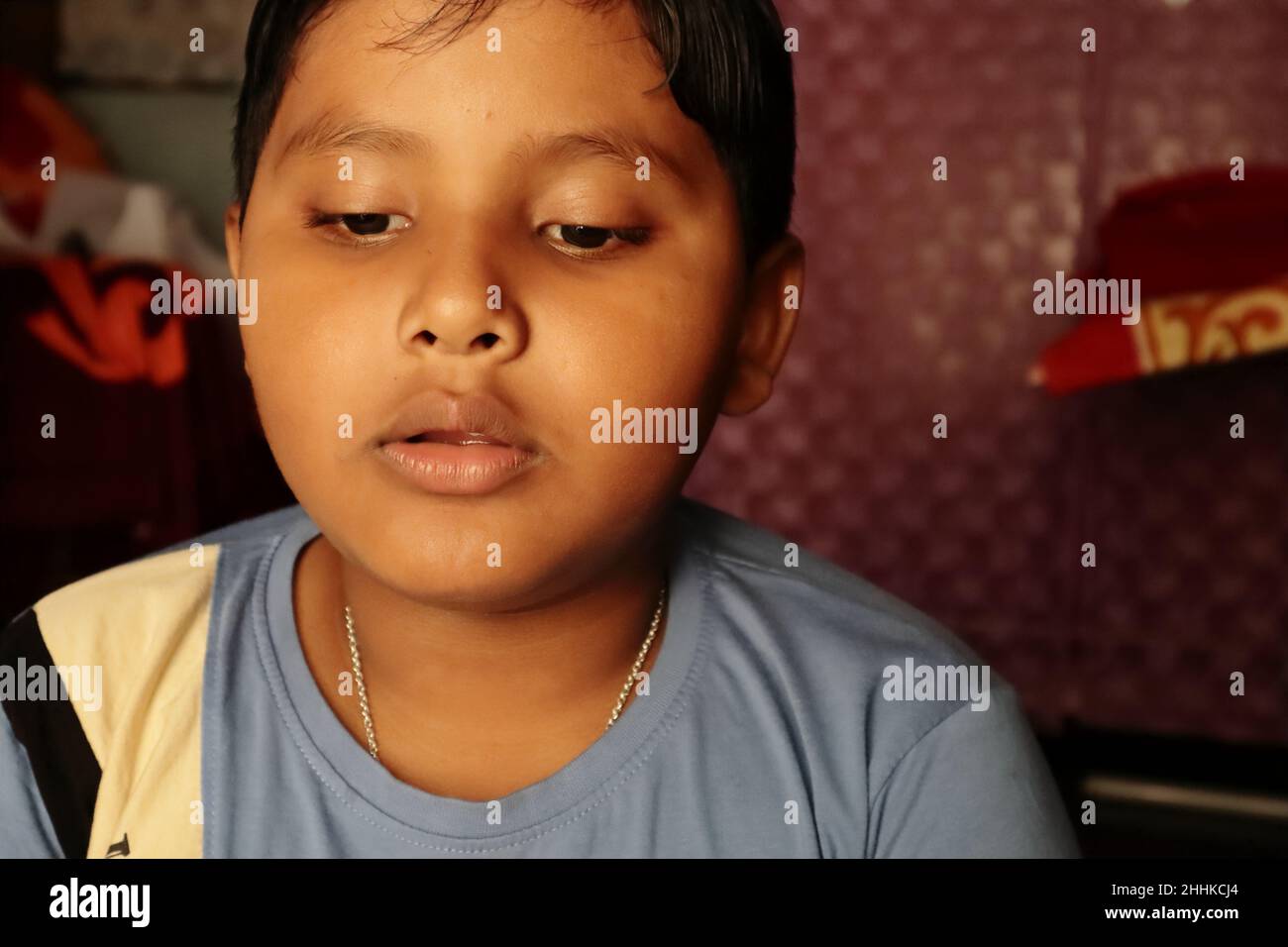Expression of sorry face by lowering the eyes Stock Photo - Alamy