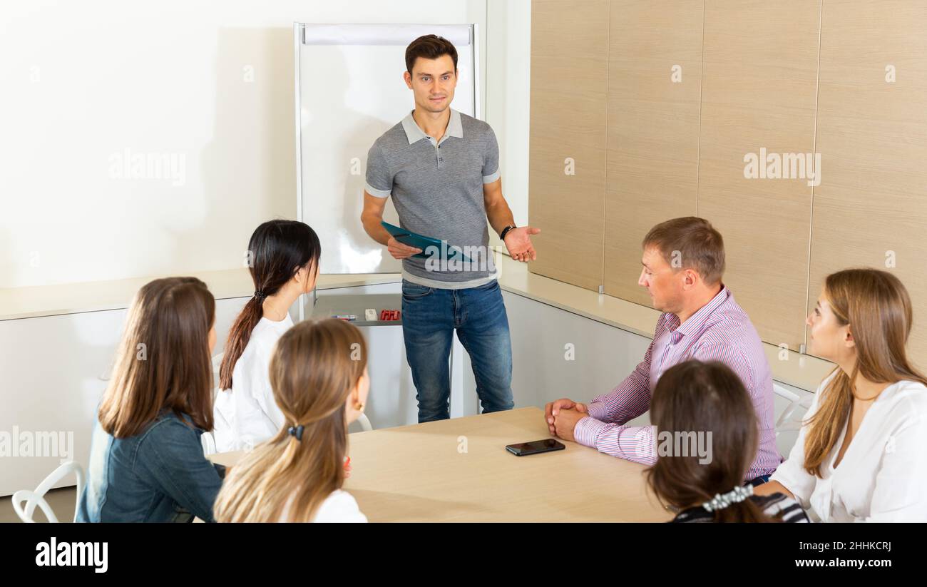 Manager presenting strategy to colleagues Stock Photo - Alamy