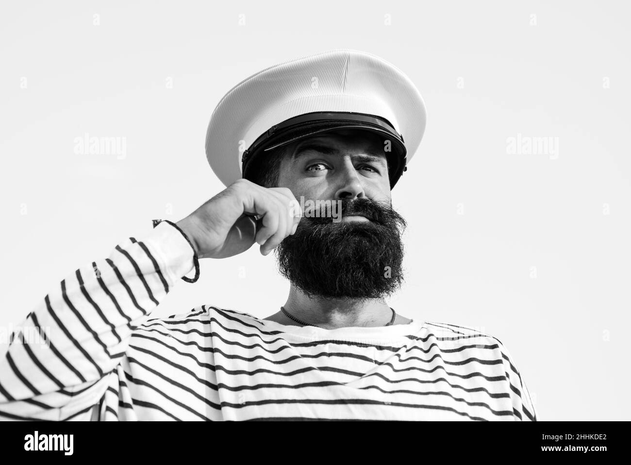 Funny captain sailor wearing hat. Seaman fun. Portrait of serious ...