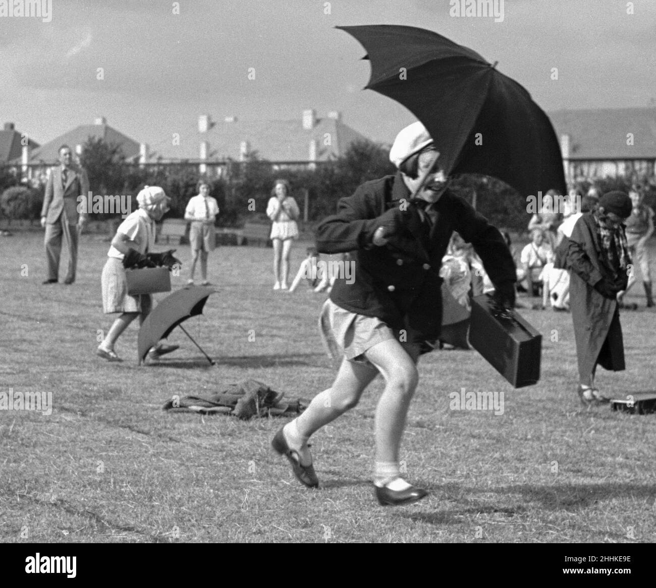 The umbrella race during a schools sports day in Kingston Upon Thames ...