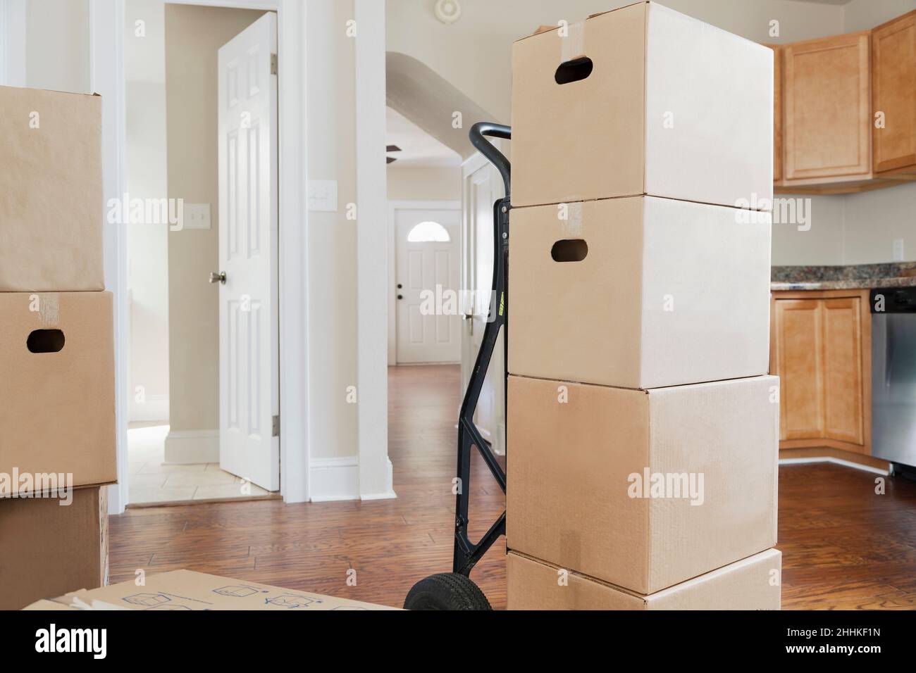 Moving boxes in new house Stock Photo - Alamy