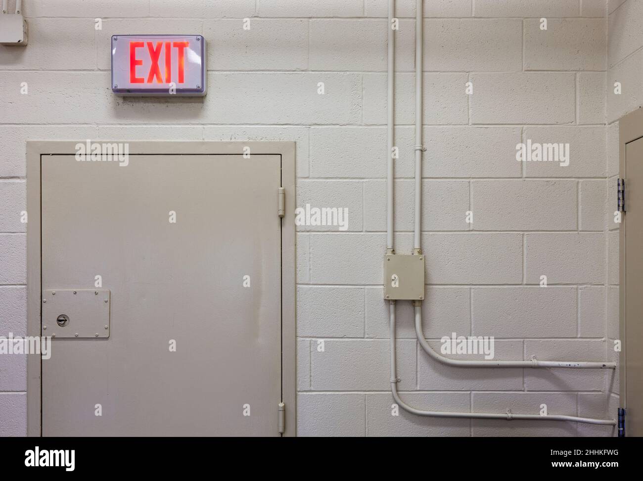 Exit sign in industrial interior Stock Photo - Alamy