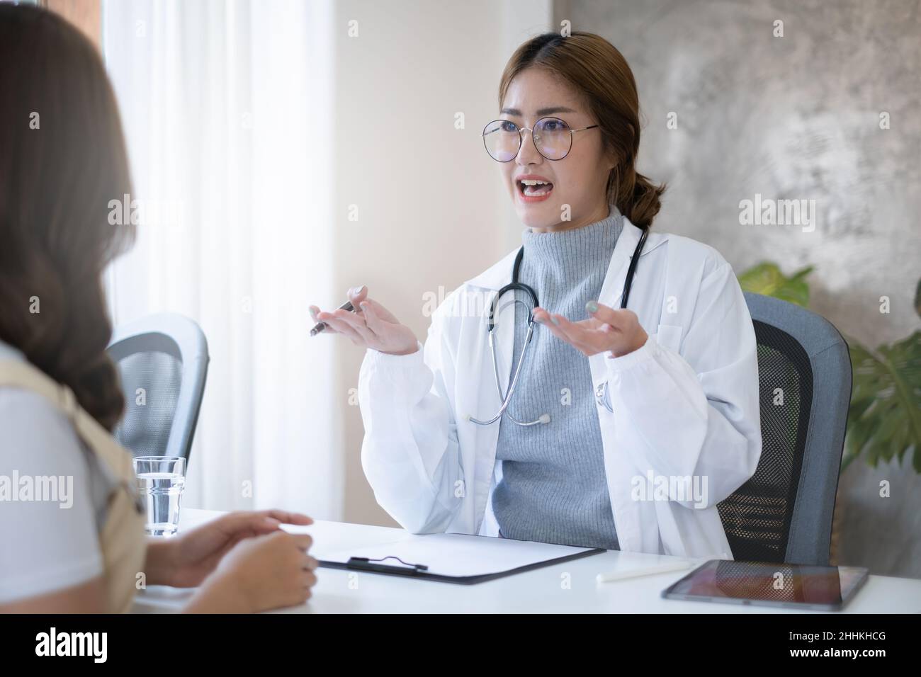 Doctor discussing and explain to patient about life plan. Medicine and ...