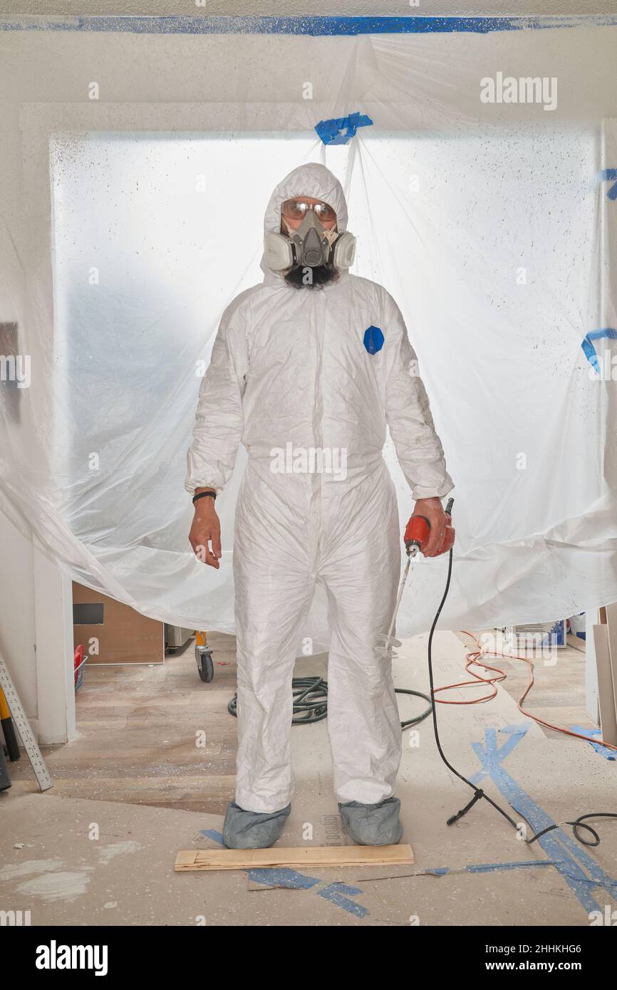 Wearing protective suit hi-res stock photography and images - Alamy