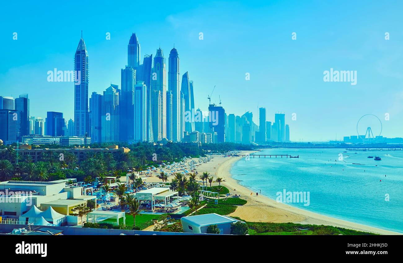 The coastal cityscape with the sand beachline, azure waters of Persian ...