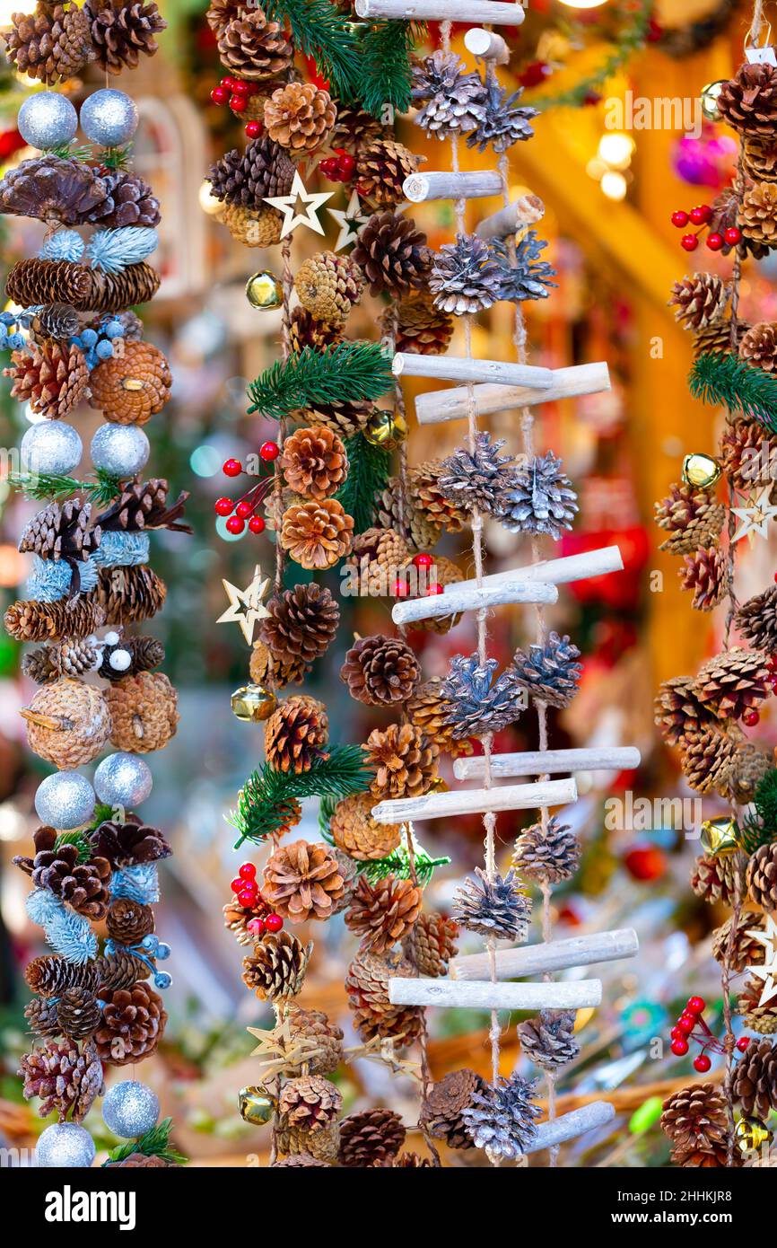 Colorful handmade Christmas decorations hanging on traditional winter ...
