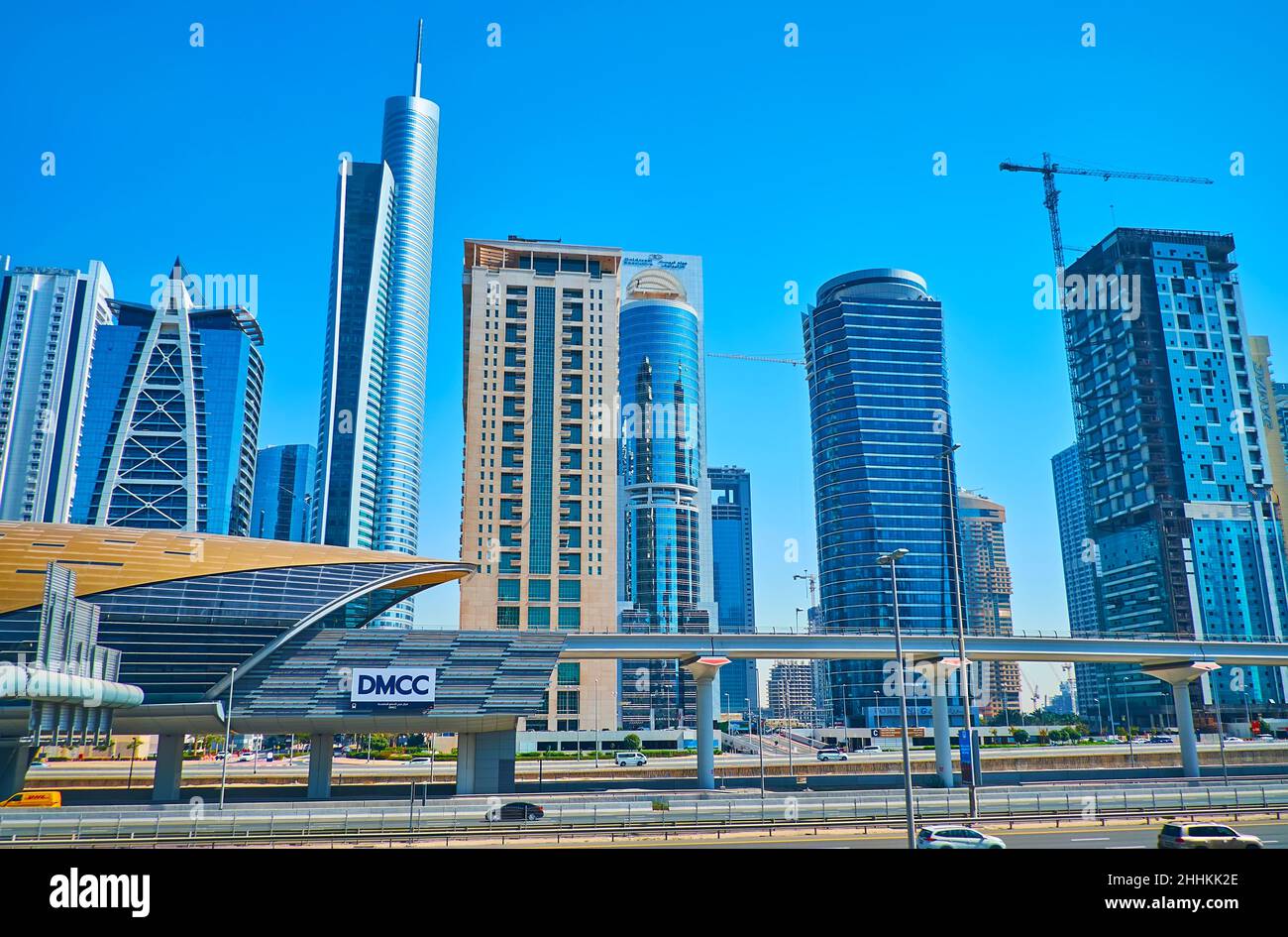 DUBAI, UAE - MARCH 7, 2020: DMCC Metro Station in front of the glass ...