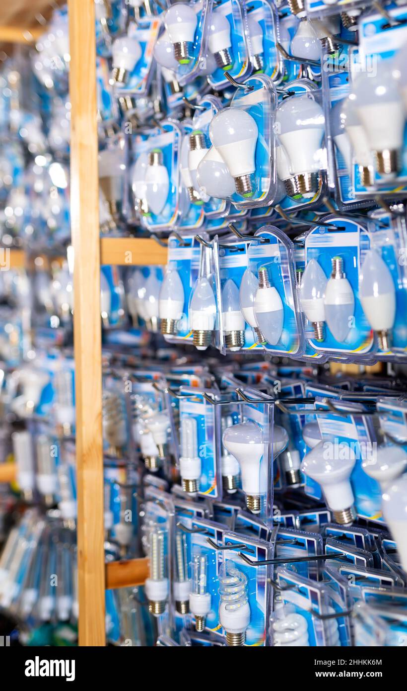 Energy saving lamps on shelves of an electrical goods store Stock Photo ...