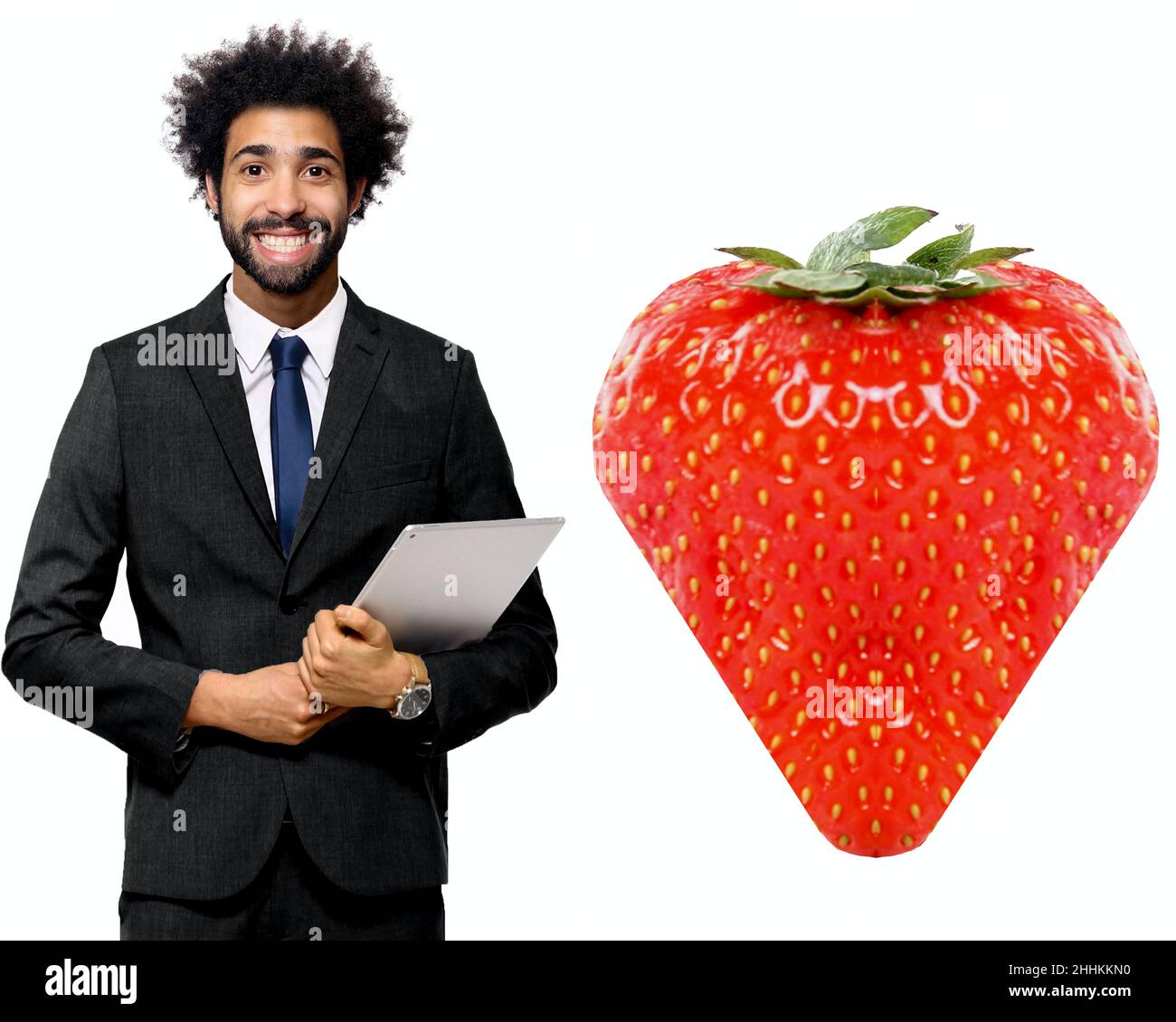 Beautiful man with a strawberry Stock Photo - Alamy