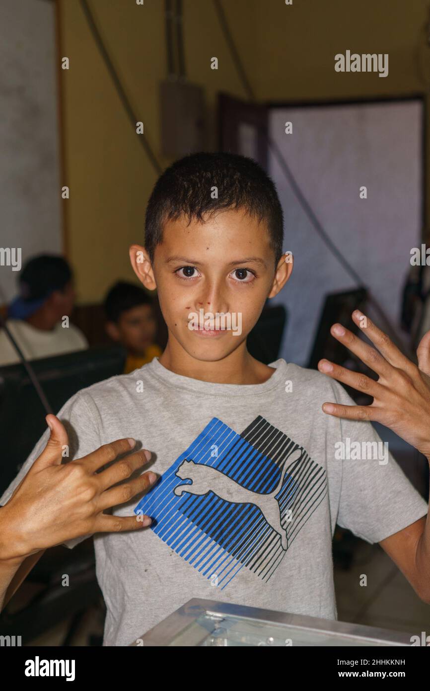 Nicaraguan deaf boy demonstrates Nicaraguan Sign Language at a shelter ...