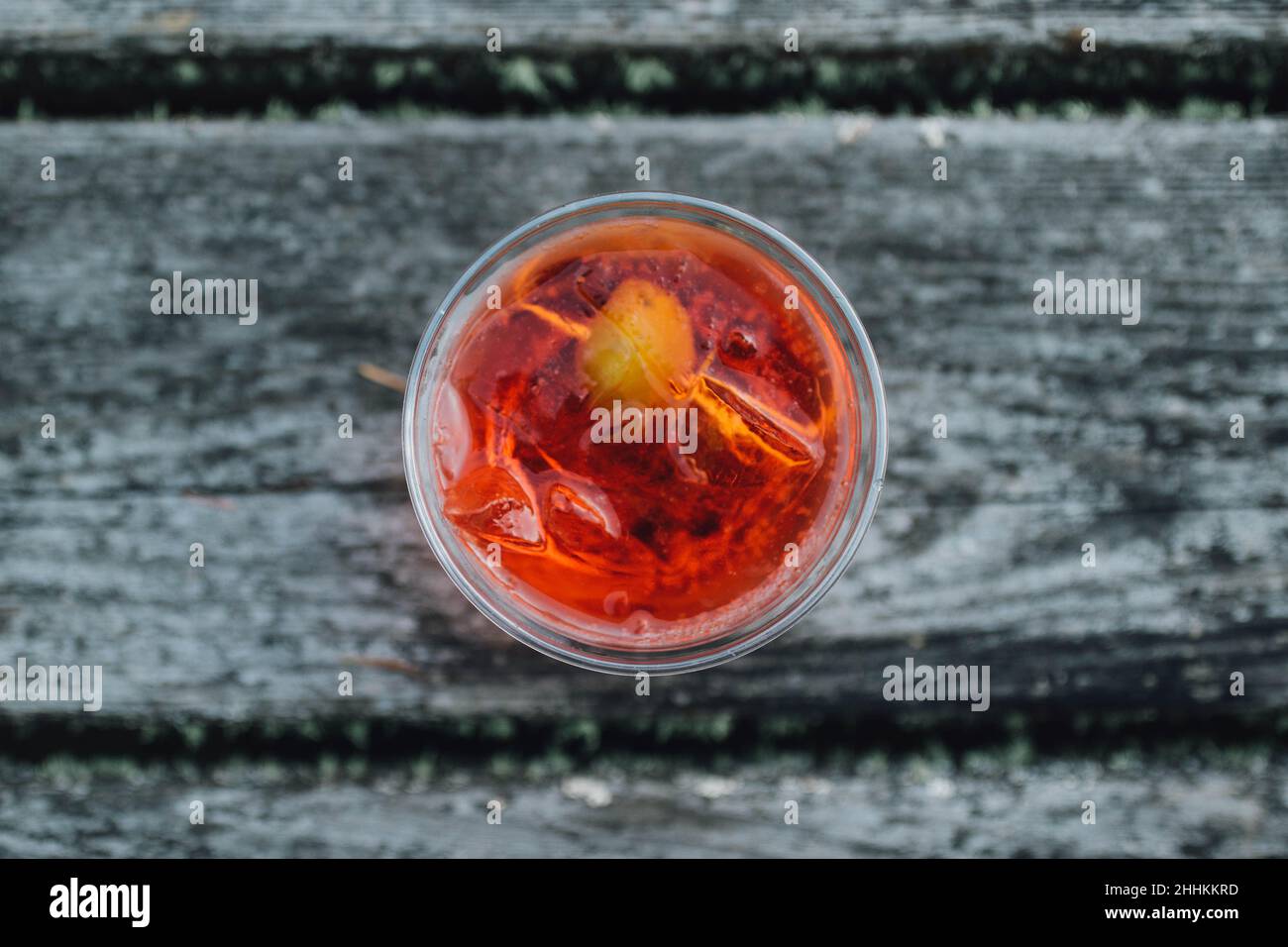 Aperol spritz in plastic cup with green olives outdoors Stock Photo - Alamy