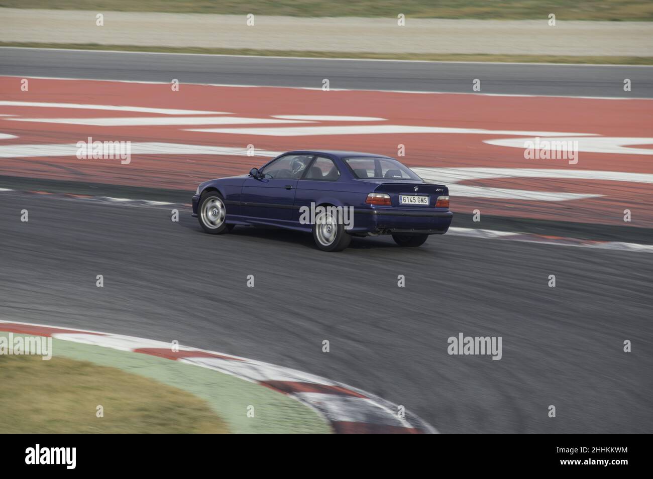 A cool modified BMW E36 racing on the road during a competition in ...