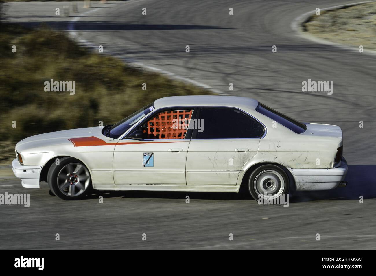 Cool modified BMW E34 530i racing on the road during a competition in ...