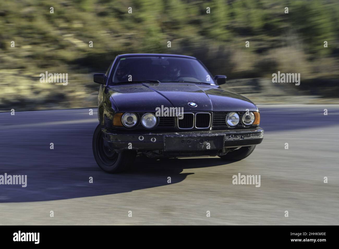 Modified BMW E34 530i racing on the road during a competition in ...