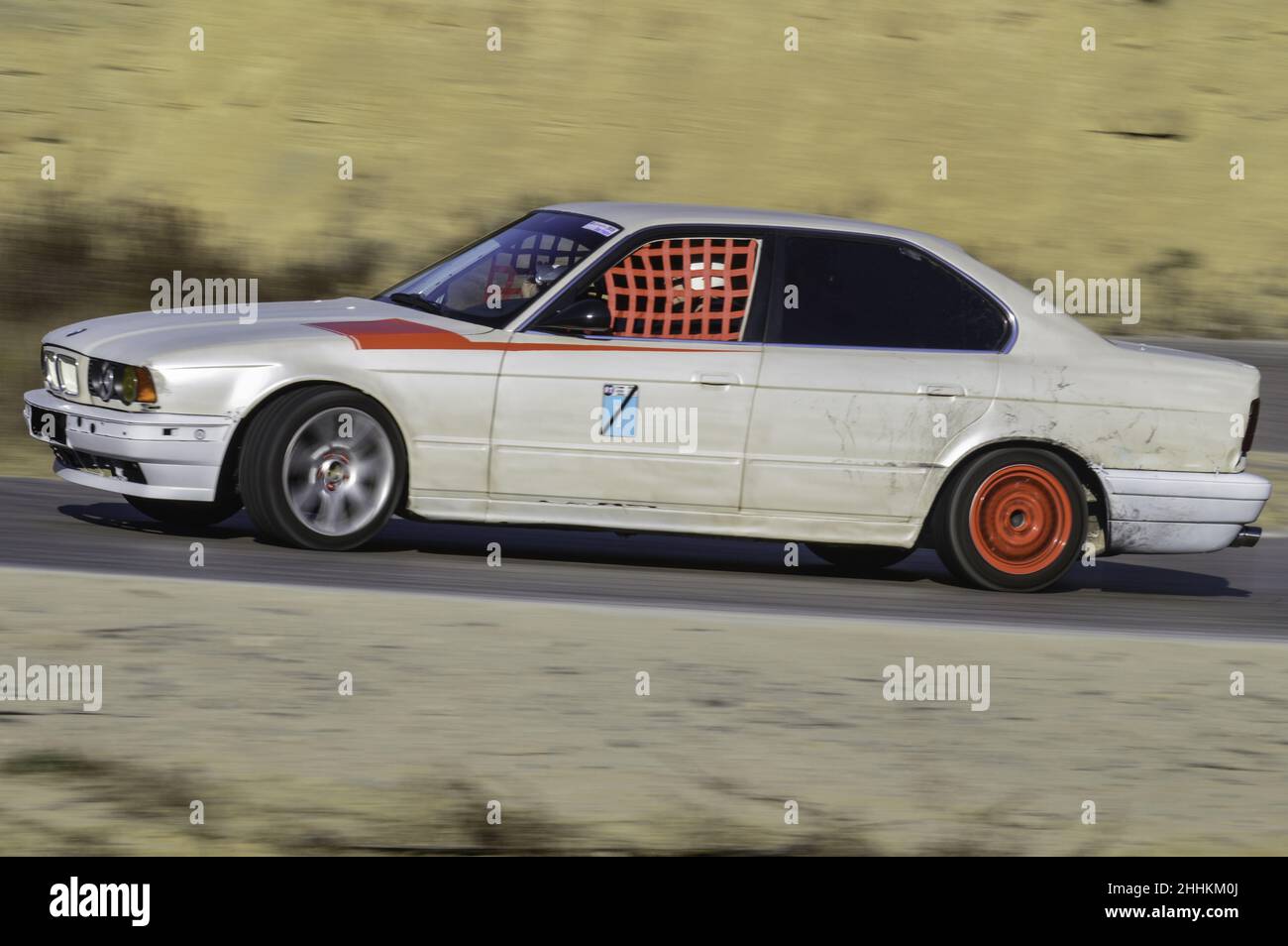 Modified BMW E34 530i racing on the road during a competition in ...