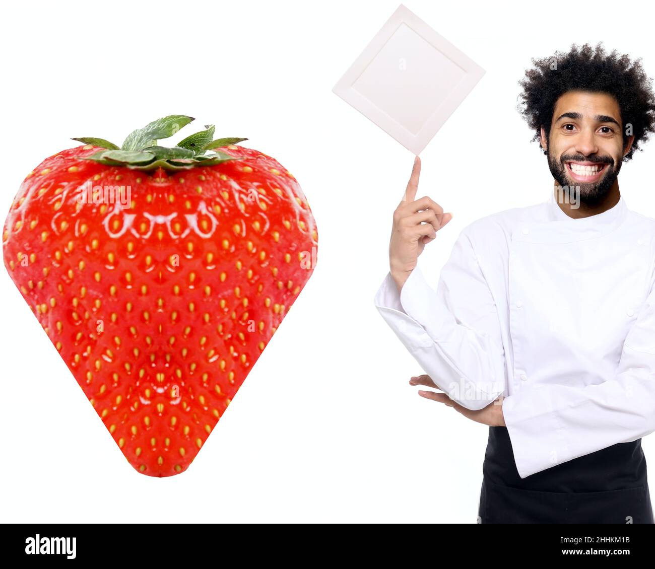 Beautiful man with a strawberry Stock Photo - Alamy