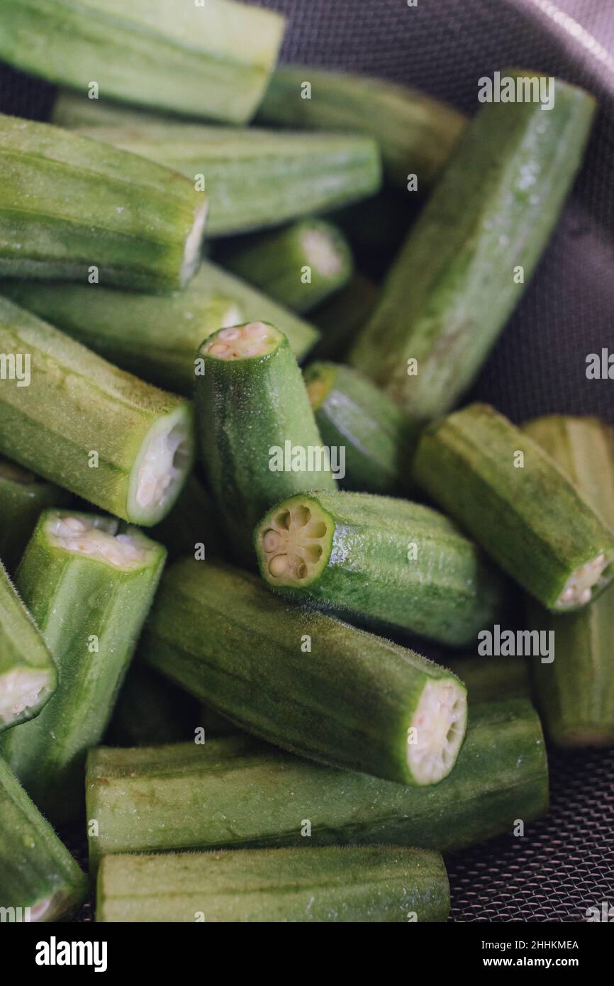 fresh, cut washed okra in mesh sieve strainer Stock Photo - Alamy
