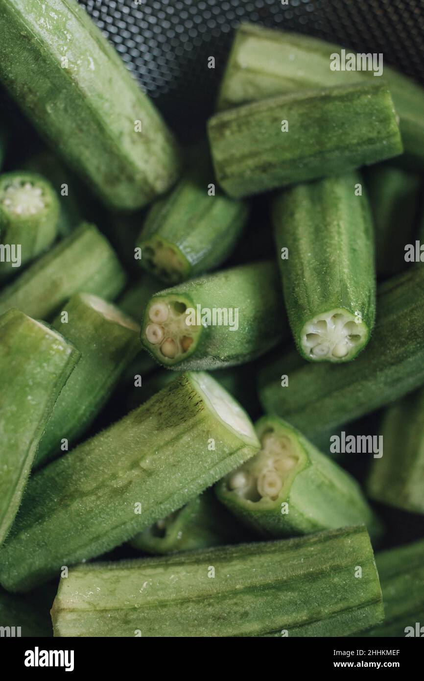 fresh, cut washed okra in mesh sieve strainer Stock Photo - Alamy