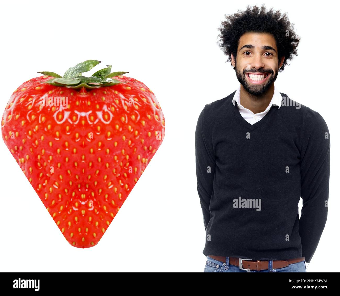 Beautiful man with a strawberry Stock Photo - Alamy