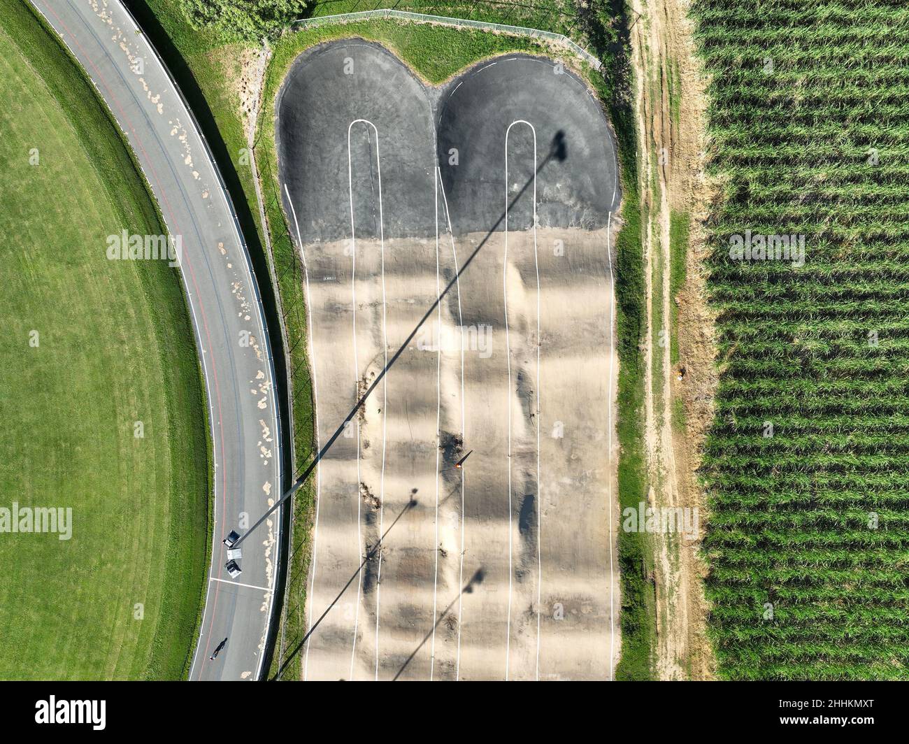 Drone aerial view looking down onto a velodrome and bmx bicycle track ...