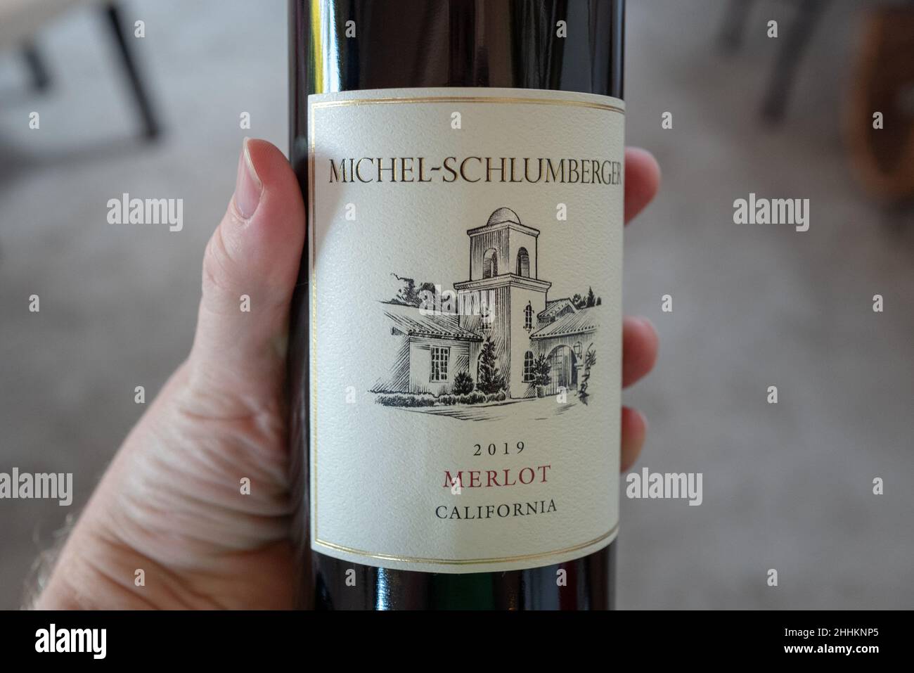 Hand holding a bottle of Michel-Schlumberger Merlot wine, Monterey ...