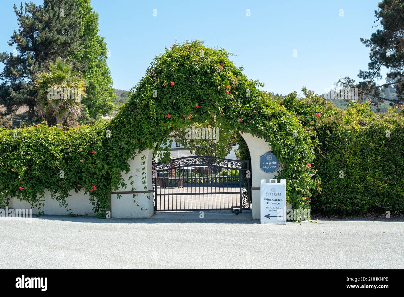Entrance arch covered with vines at Folktale Winery and Vineyard ...