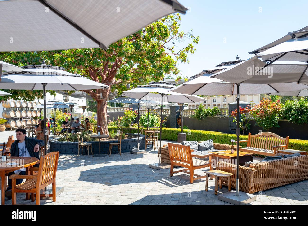 People dine and taste wines at outdoor tables at Folktale Winery and ...