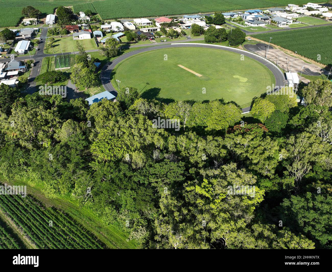 Aerial view down onto a velodrome, bmx track amongst suburban homes ...