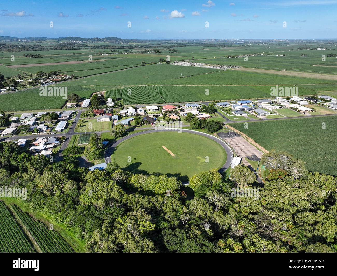 Aerial view down onto a velodrome, bmx track amongst suburban homes ...