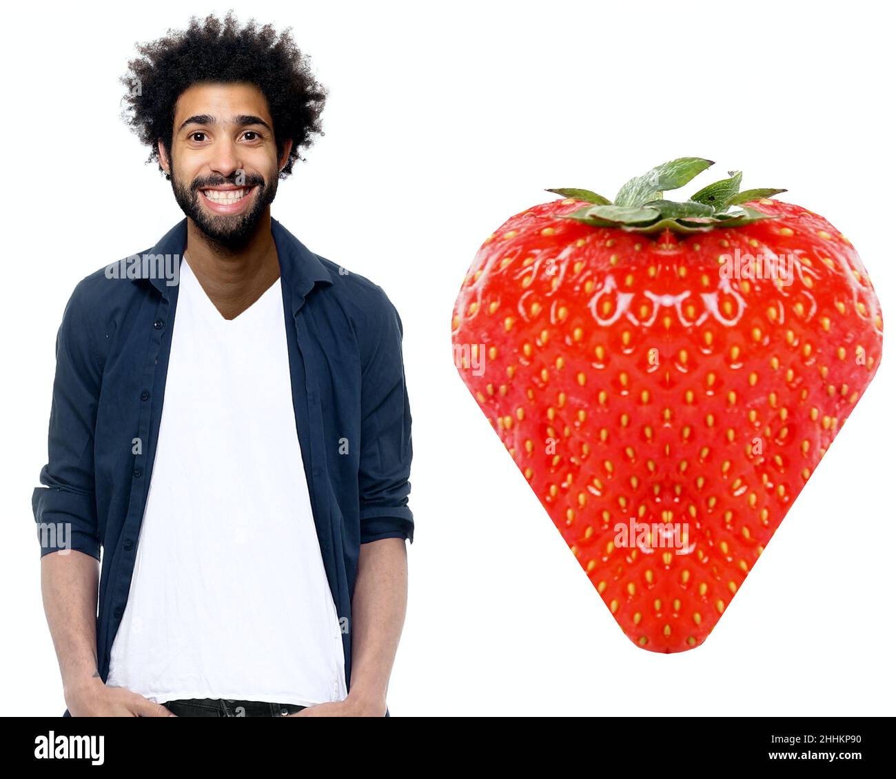 Beautiful man with a strawberry Stock Photo - Alamy