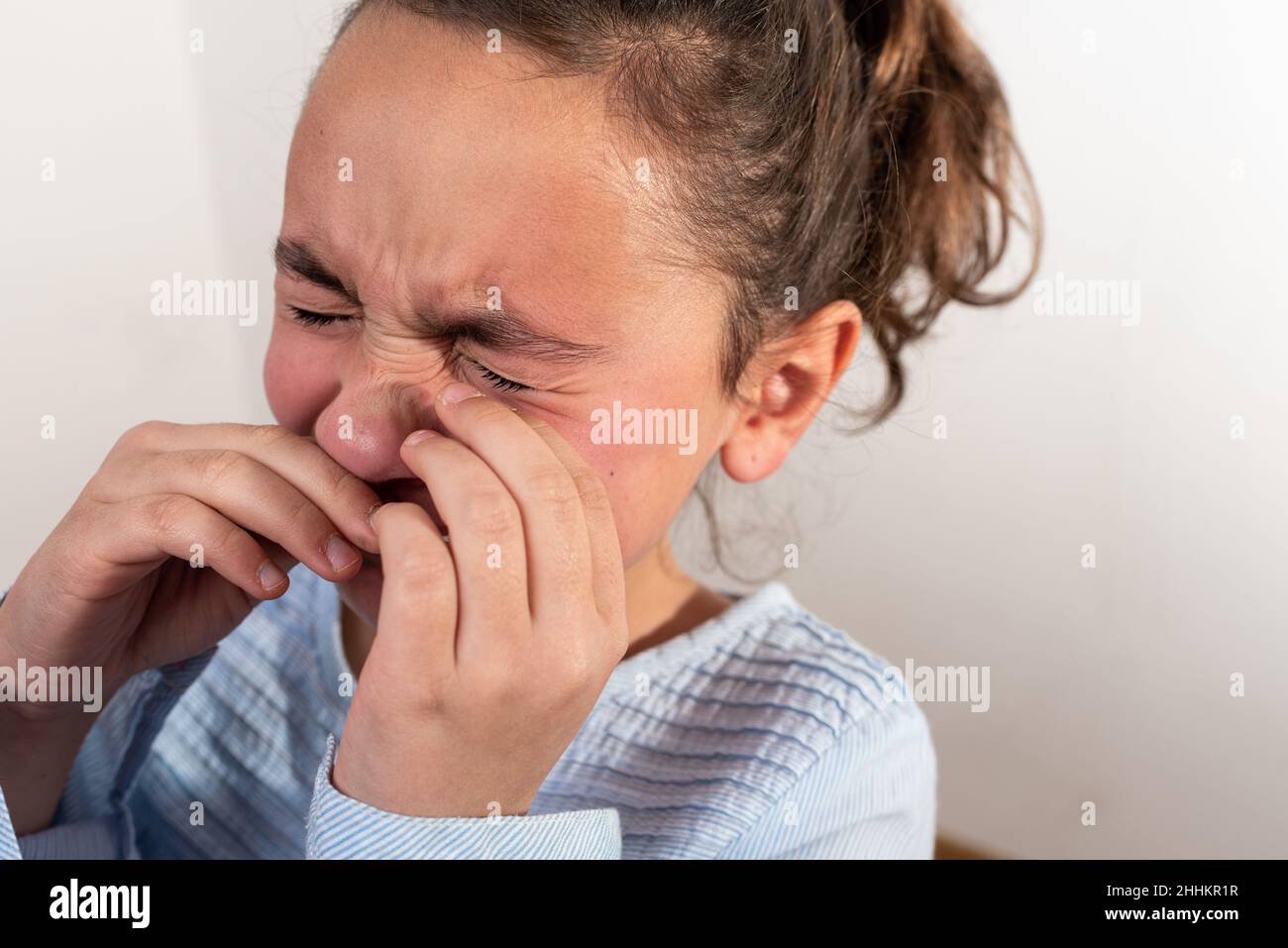Little girl crying and suffering pain after getting a rapid COVID-19 ...