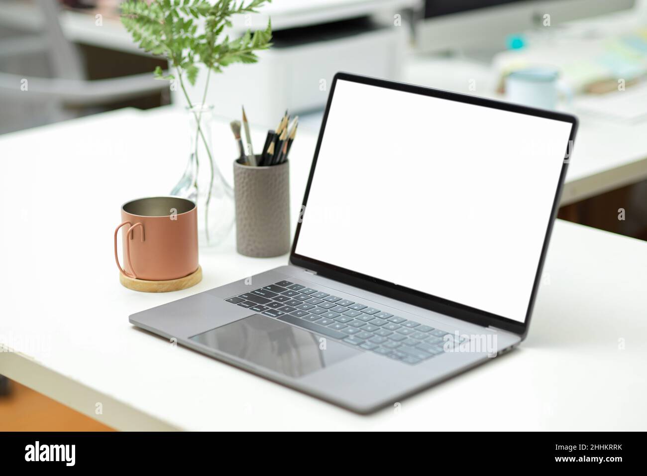 Modern bright workspace with notebook laptop computer blank screen ...