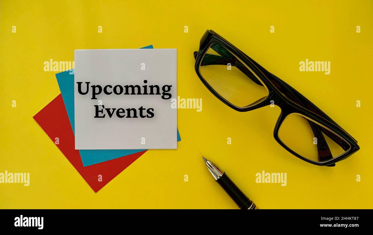Upcoming events - message on white notepad. With glasses, pen and ...