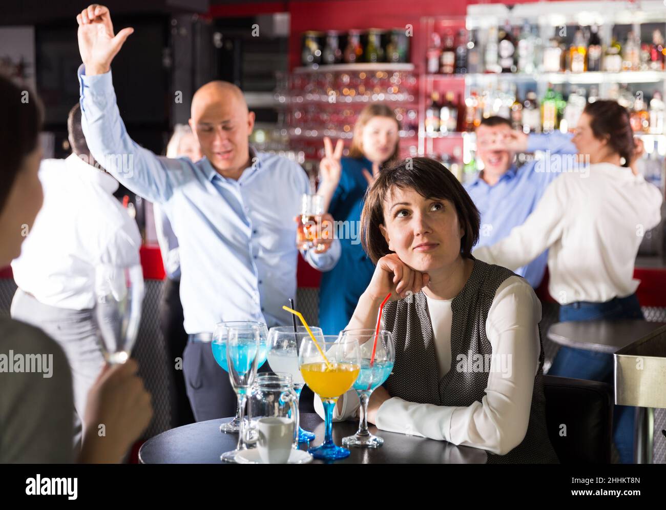 Woman tired during corporate party Stock Photo - Alamy