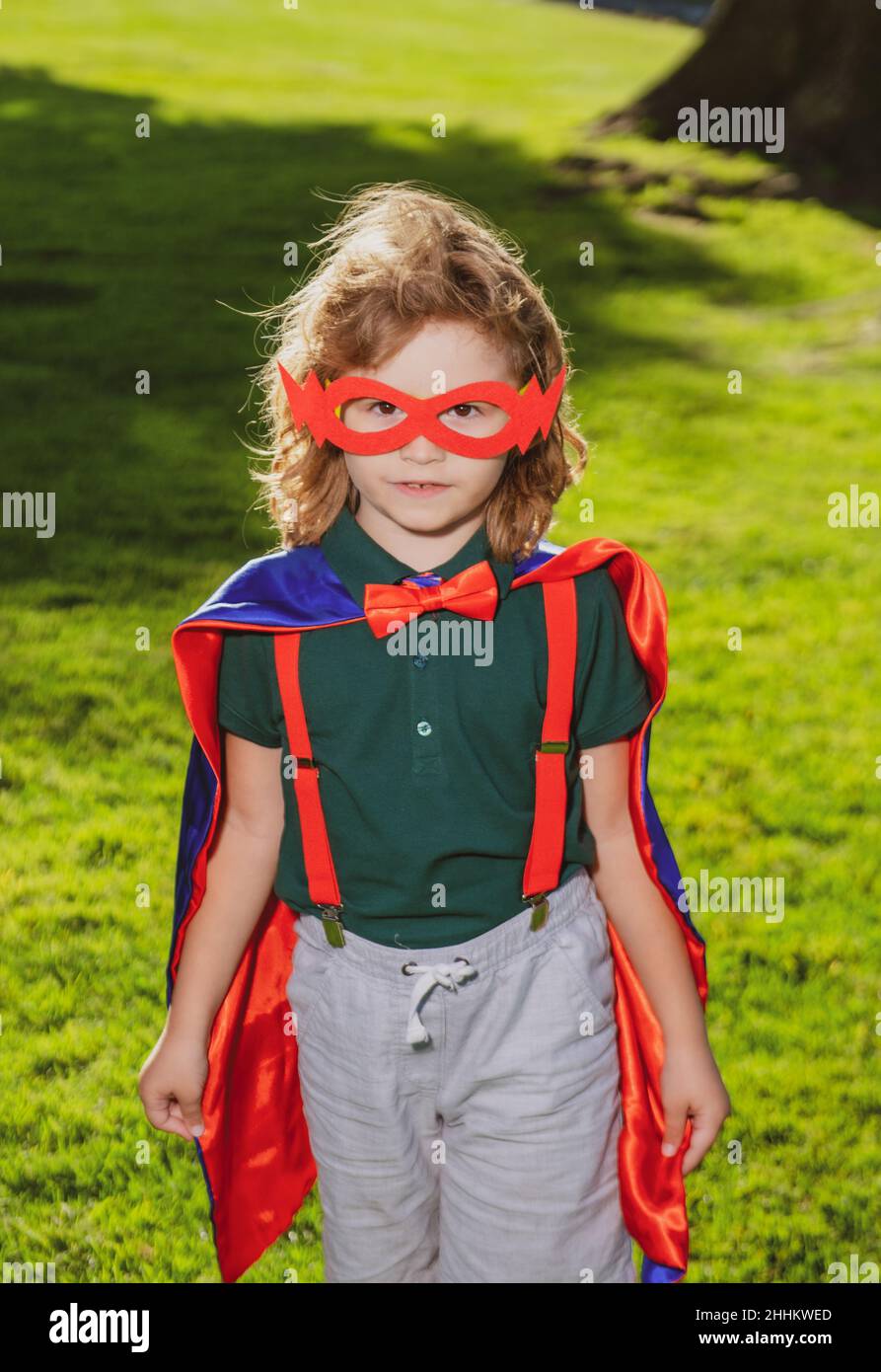 Superhero kid outdoor in park. Child power concept Stock Photo - Alamy