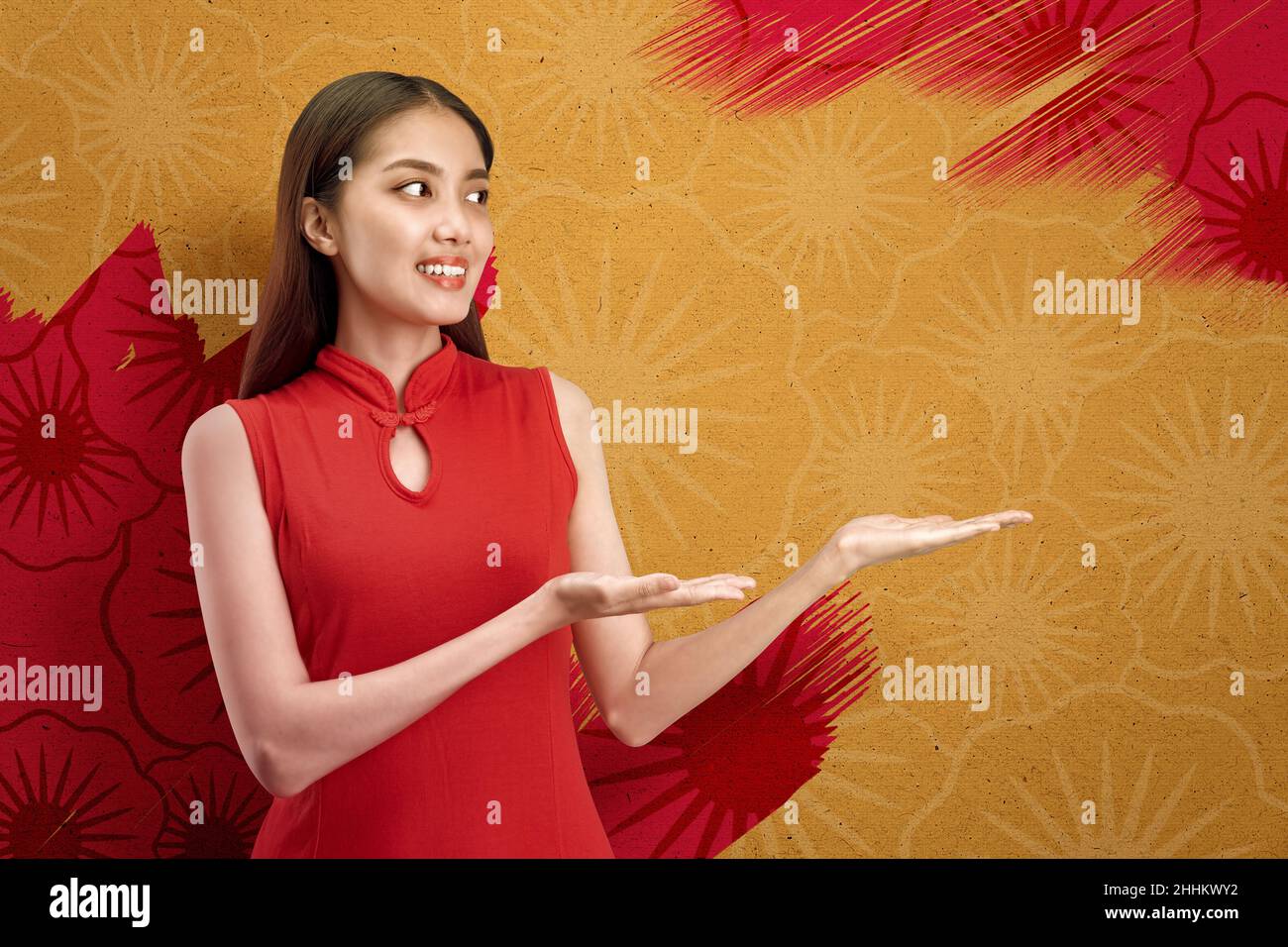 Asian Chinese woman in a cheongsam dress with open palm showing ...