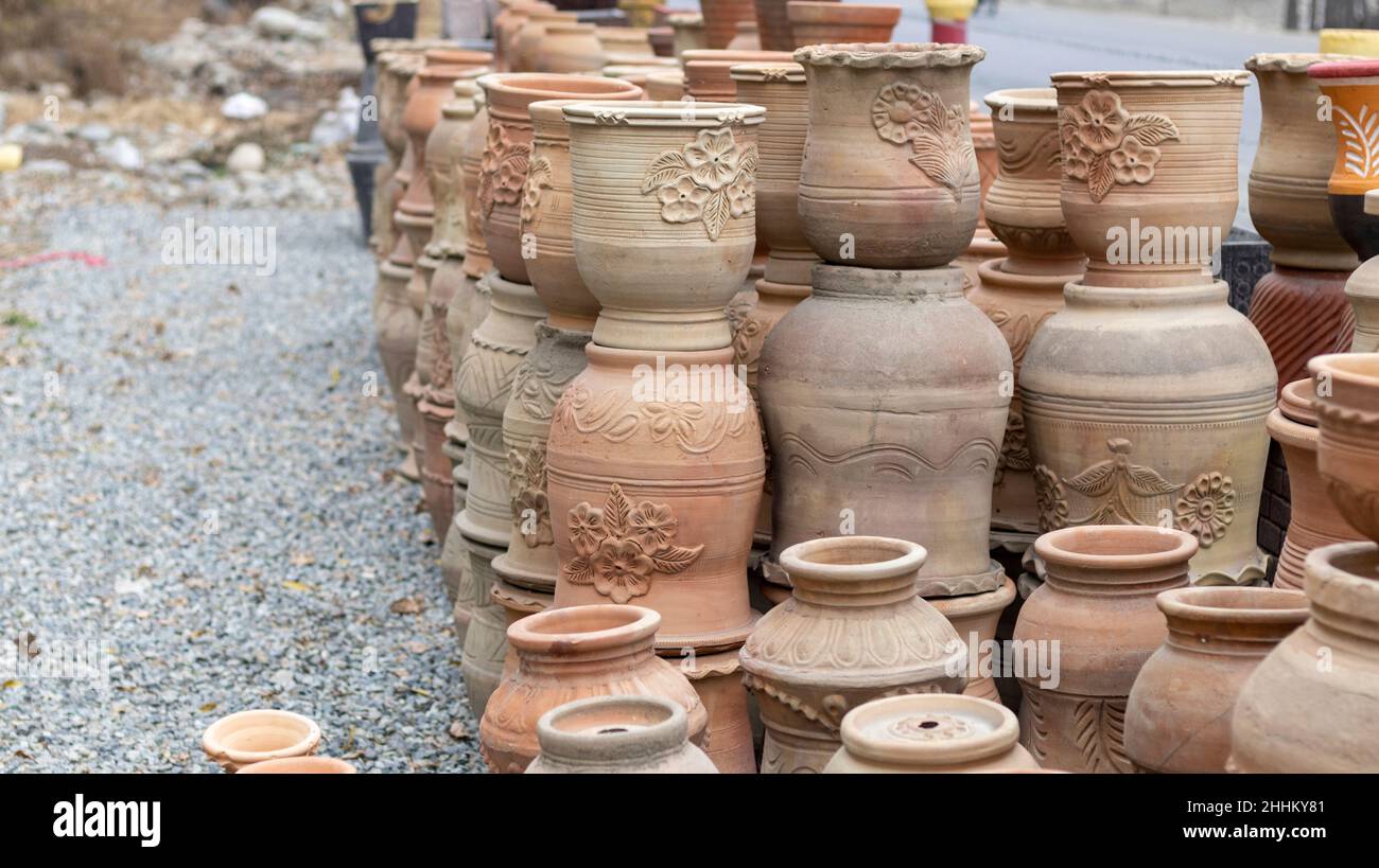 Empty Clay pots for plants are displayed for sale at a plant nursery ...