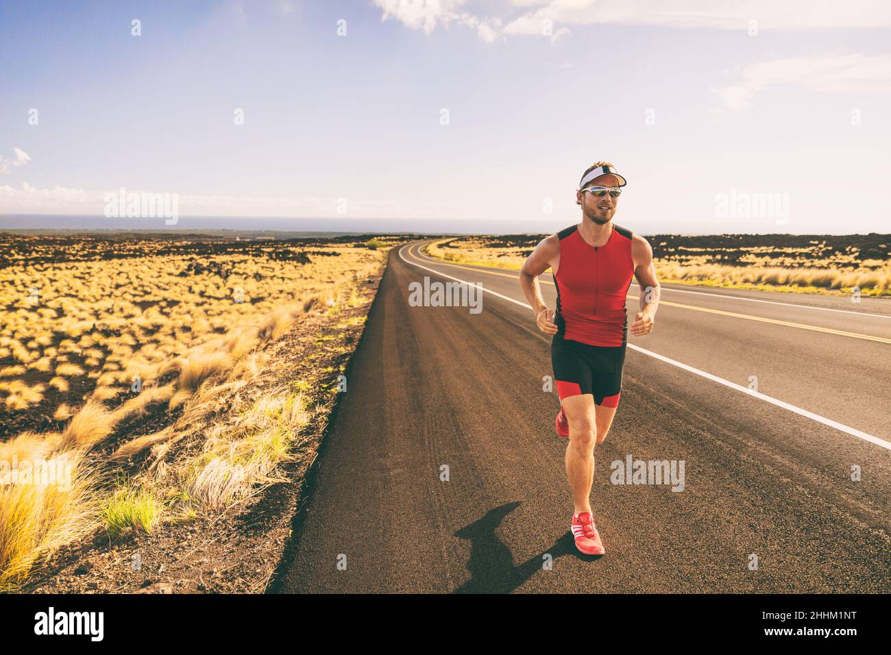 Sport run triathlon compettion man running on road during marathon race ...