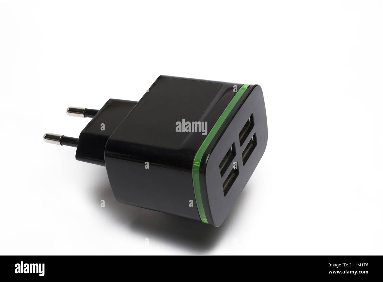 Close up of black EU plug adapter with four USB ports for cell phone ...